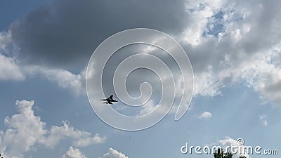 View of a Thunderbird Fighter Jet Flying Overhead in a Blue Cloudy Sky ...