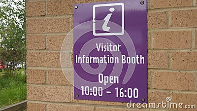 Visitor Information Booth Sign on Brick Wall Stock Footage - Video of ...