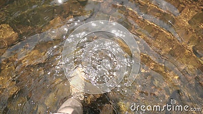 Walking into the Shallow Water with Little Rocks Under Water Stock ...