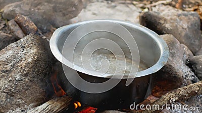 Boiling Water In The Pot Over A Campfire Stock Video - Video of ...