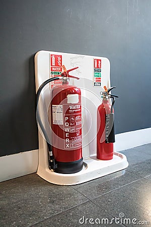 Water And Carbon Dioxide Fire Extinguishers At A Fire Station By A Wall ...