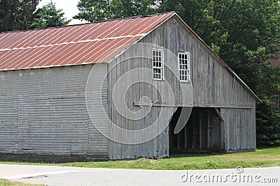 Weathered Grey Amish Barn With Red Metal Roof Stock Photography - Image ...