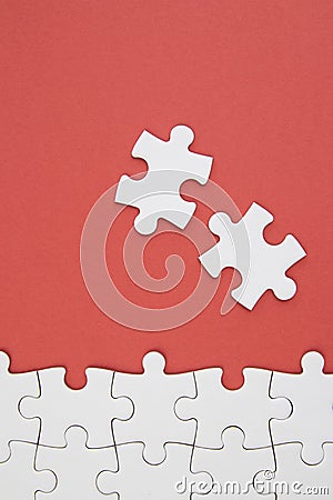 White Jigsaw Puzzle Pieces On Red Background With Negative Space ...
