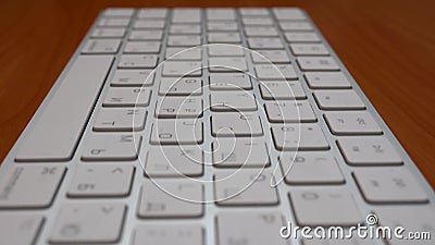 White Wireless Keyboard on the Table Close-up. the Camera Moves Away ...