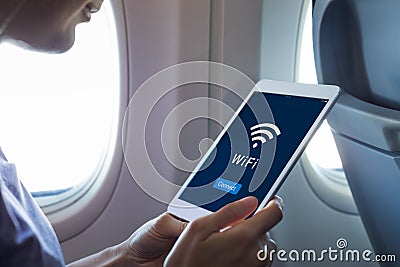 Wifi Internet Access In Airplane During Flight, Passenger Using Tablet ...