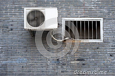 A Window And A Air Conditioner On The Grey Brick Wall Background ...
