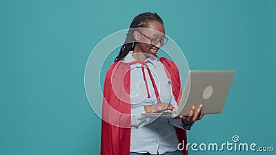 Woman Dressed As Superhero Using Laptop in Studio Stock Footage - Video ...