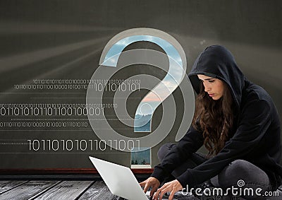 Woman Hacker Seated And Working On A Laptop With A Grey Background With ...