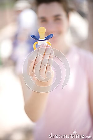 Woman Holding Pacifier Stock Images - Image: 5193274