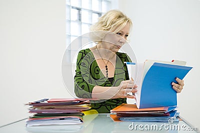 Woman Looking Through Files Royalty Free Stock Images - Image: 5620979