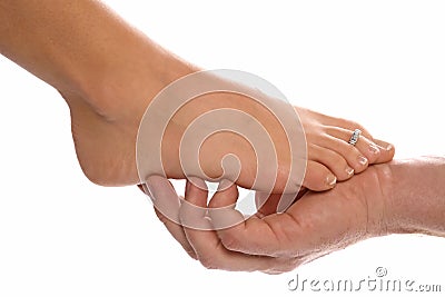 Woman's Foot And Mans Hand Stock Photo - Image: 11743260