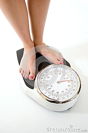 Woman Standing On Weighing Scales Stock Photo - Image: 51068981
