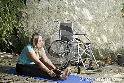Woman Stretches Next To Wheelchair - Vertical Royalty-Free Stock ...