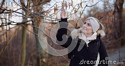 Woman Touching Tree Branch on a Walk in Park Stock Footage - Video of ...
