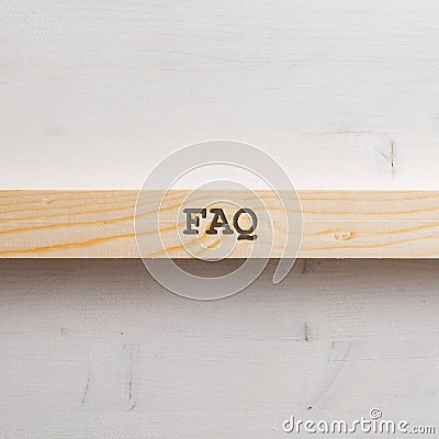 Wooden Slat With A FAQ Sign On It Placed Over Plain Simple Wooden ...