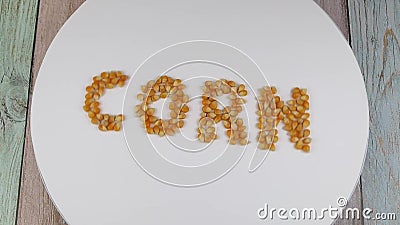The Word Corn is Written with Grains of Corn Rotating on a White ...