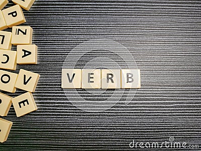 Word Verb Made From Square Letter Tiles Against Black Background ...
