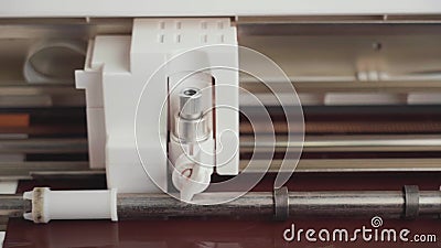 The Work of a Compact Cutting Plotter in Close-up. the Cutting Head of ...