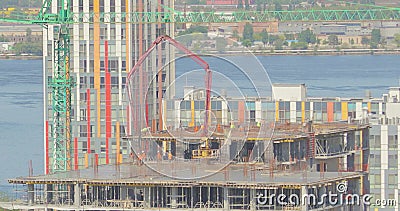 Work at the Construction Site of a Multi-storey Building. Workers Build ...
