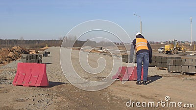 The Worker Blocks a Special Block Entry on the Road Which is Under ...