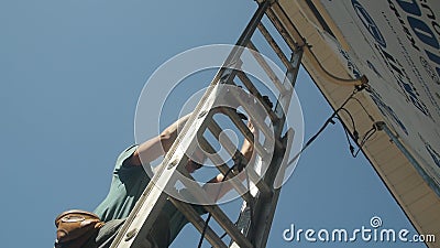 Man climbing down a ladder stock video. Video of build - 233202955