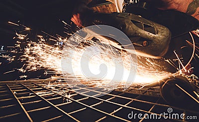 Worker Using Angle Grinder In Factory And Throwing Sparks. Stock ...