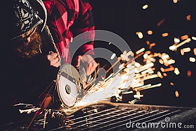 Worker Using Angle Grinder In Factory And Throwing Sparks. Royalty-Free ...