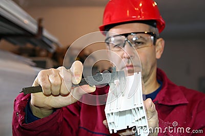 Worker Using A Vernier Caliper Stock Photo | CartoonDealer.com #36846362