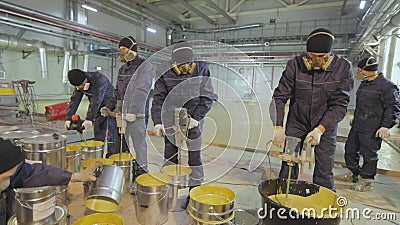 Working Process at a Construction Site. Workers Stir Up the Bulk Floor ...