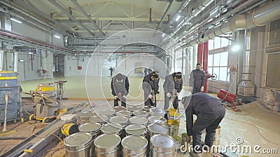 Working Process at a Construction Site. Workers Stir Up the Bulk Floor ...