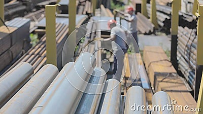 The Working Process in a Warehouse with a Metal. Workers Unload a Metal ...