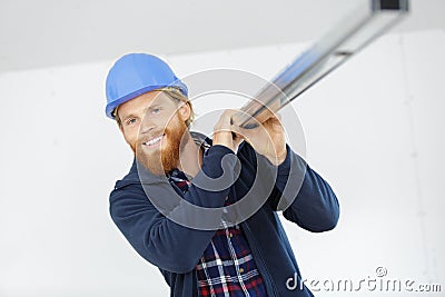 Workman Carrying Metal Frame On Shoulder Royalty-Free Stock Photography ...