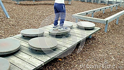 A 5-year-old Boy Plays on the Playground, Develops Balance Stock Video ...