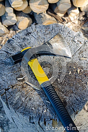 Axe With A Piece Of Wood Near A Stack Of Logs Stock Photo ...