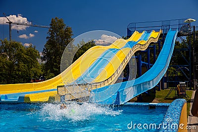 Yellow And Blue Color Water Slide In Aquapark Editorial Photo ...