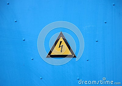 Yellow Electrical Warning Triangle Sign On Blue Background Royalty-Free ...