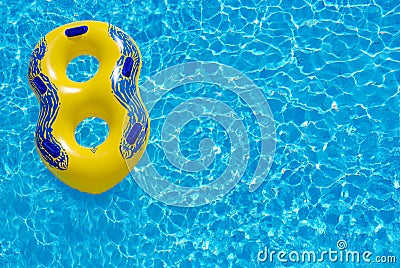 Yellow rubber ring floating on blue water - Stock Image - Everypixel