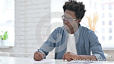 Young African Man Thinking and Writing Document Stock Footage - Video ...