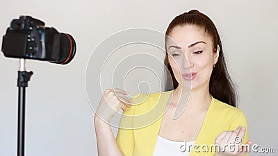 Young Beautiful Woman is Giving an Interview in Front of the Camera in ...