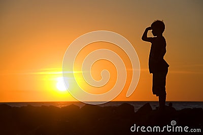 Young Boy Enjoying Sunset Stock Photos - Image: 21909333
