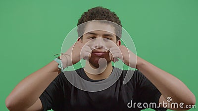 Young Boy Pinching Both Cheeks Stock Footage - Video of studio ...