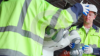 Young Engineer Man and Woman Talking and Explaining about Robot Arms ...