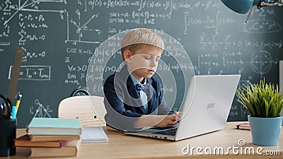 Young Genius Using Laptop Computer at School Alone Concentrated on ...