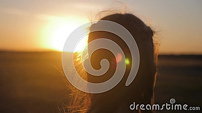 Young Girl with Her Back in the Field and Look Sunset. Stock Video ...