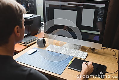 Young Man At Home Using A Computer, Freelance Developer Or Designer ...