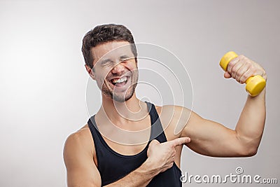 Young Man Laughing At His Flabby Muscles. Puny Muscles Royalty-Free ...