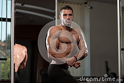 Young Man Performing Side Chest Pose Stock Photo | CartoonDealer.com ...