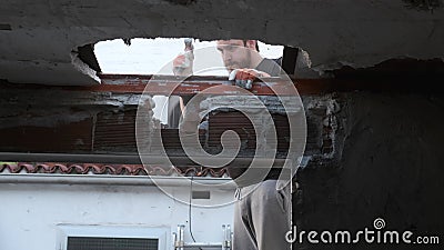 Young Man Pulling the Ceiling of a House Down. Stock Video - Video of ...