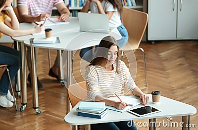 Young People Studying At Tables Royalty-Free Stock Photo ...