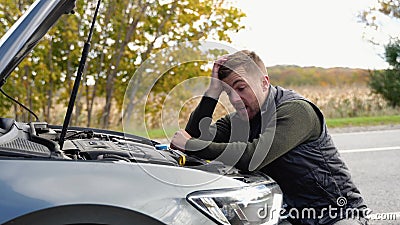 Young Stressed Man Having Trouble with His Broken Car Looking in ...